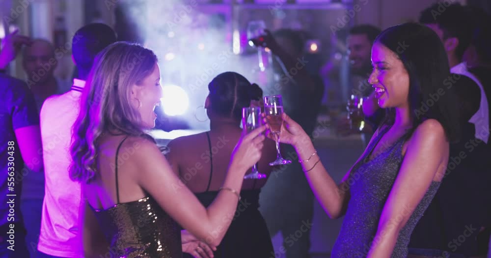 Dance, nightclub and champagne with woman friends drinking while ...