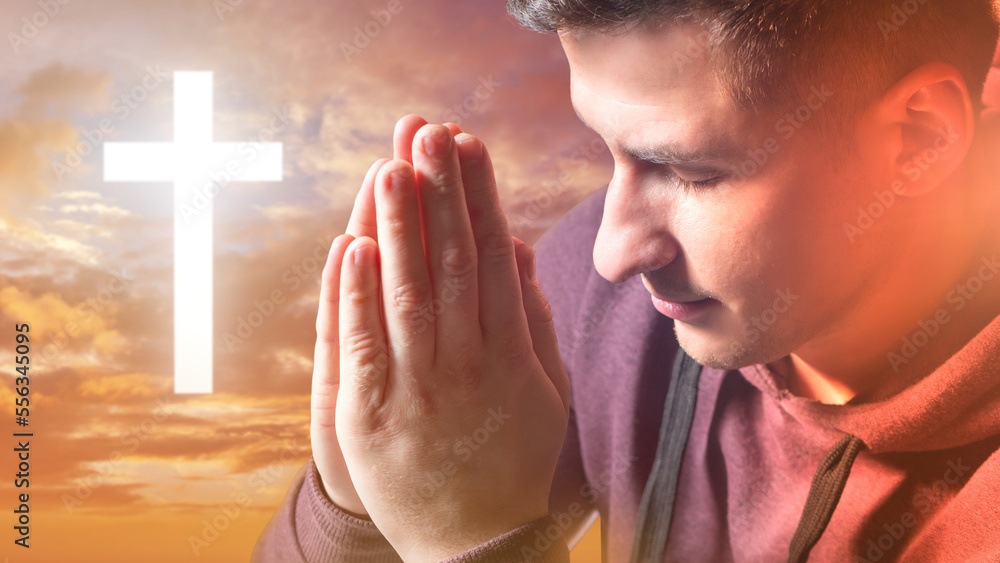 Man is praying. Christian cross in sky. Praying hands. Religious ...