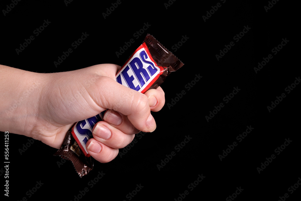 Magdalinovka, Ukraine - December 23, 2022. Female hand holding a ...