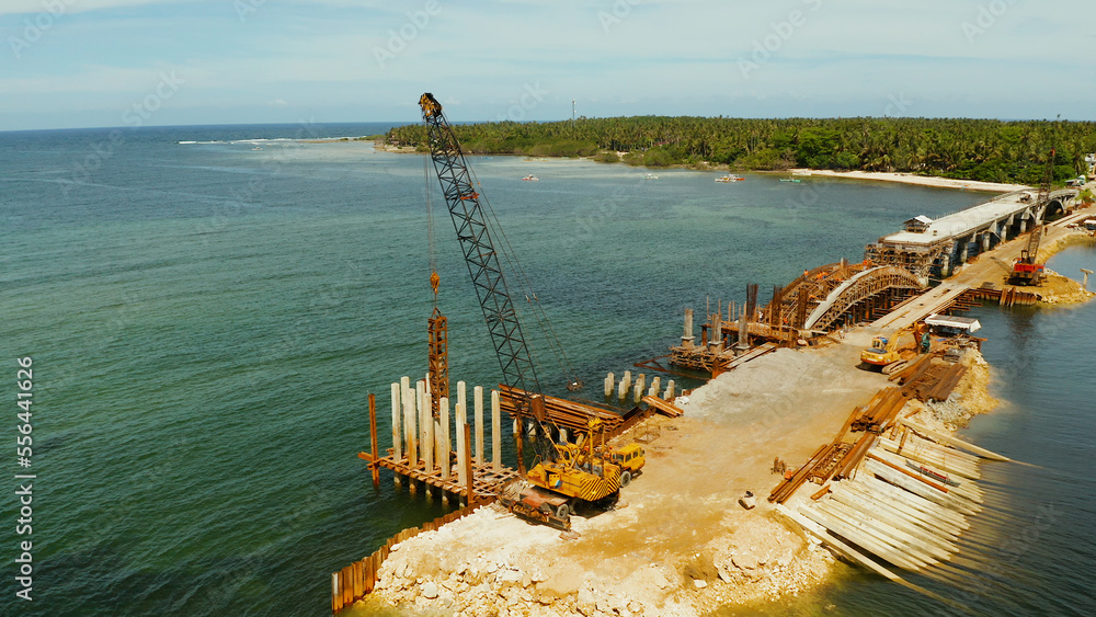 Pile driving is installing concrete pile. Heavy construction equipment ...