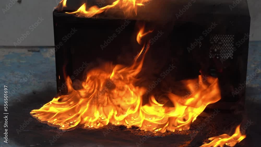 microwave oven on fire. the concept of fire in the kitchen and ...
