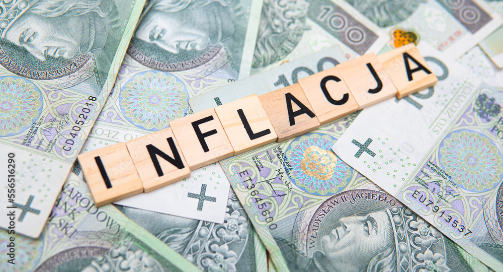 inscription Inflacja next to Polish money. Business background showing ...