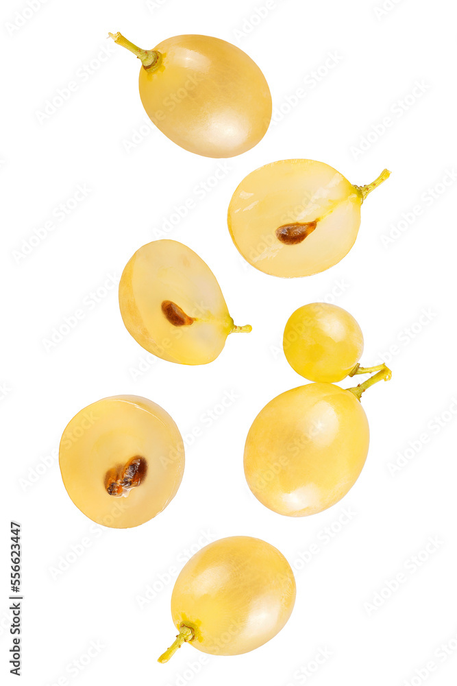 Isolated flying grapes. Seven whole and sliced grape fruits falling on ...