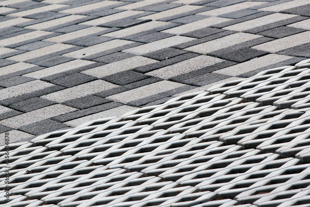 Border between ordinary pavement and permeable concrete block tiles ...