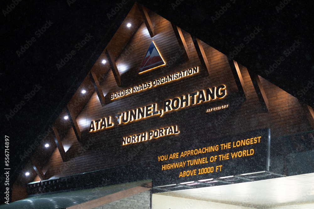 Shot of North Portal of the Atal tunnel during the snowfall at night on ...