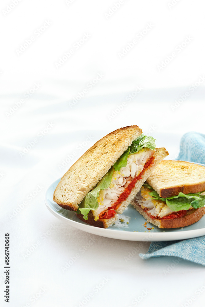 Almond Coated Fish Sandwich on Toasted Rye Bread, Cut in Half, Studio ...