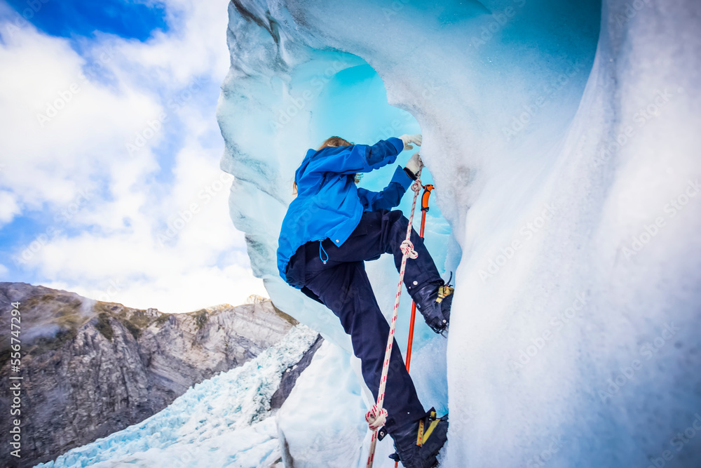 Travellers explore New Zealand's famous Franz Josef Glacier. Blue Ice ...
