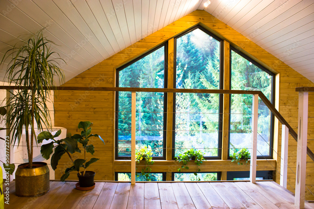 Second floor of two-story wooden cottage inside in coniferous spruce ...