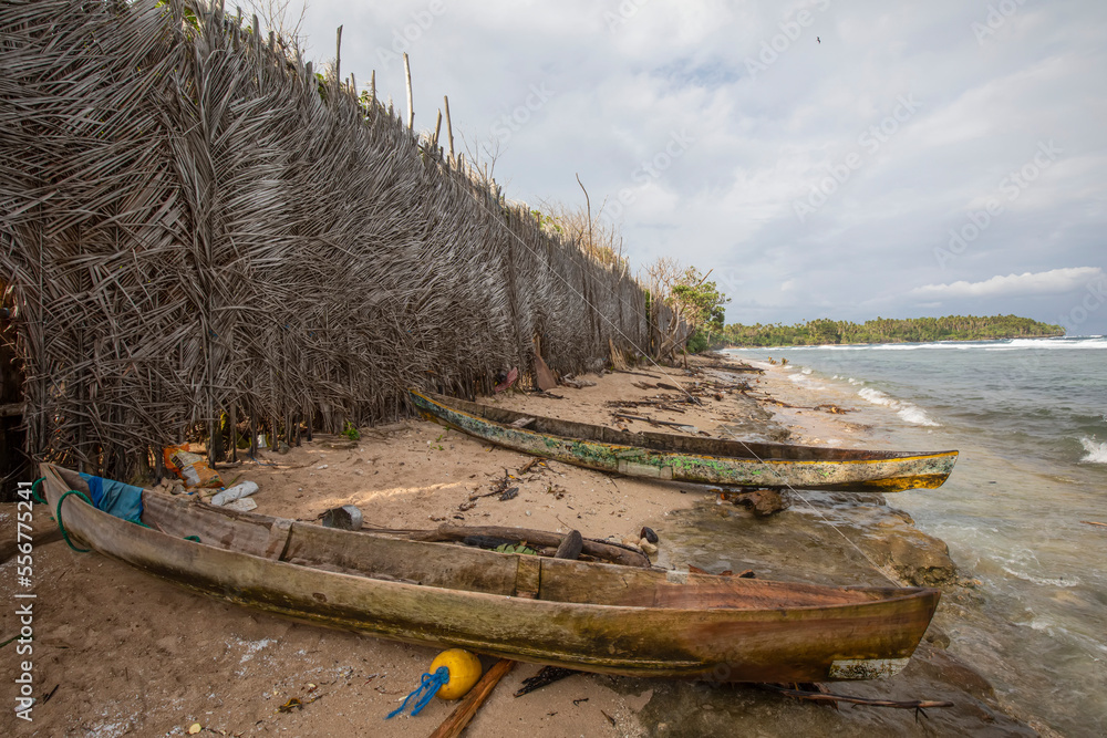 Woven sago palm wall and canoes, Tuam Island, Siassi Islands, Vitiaz ...