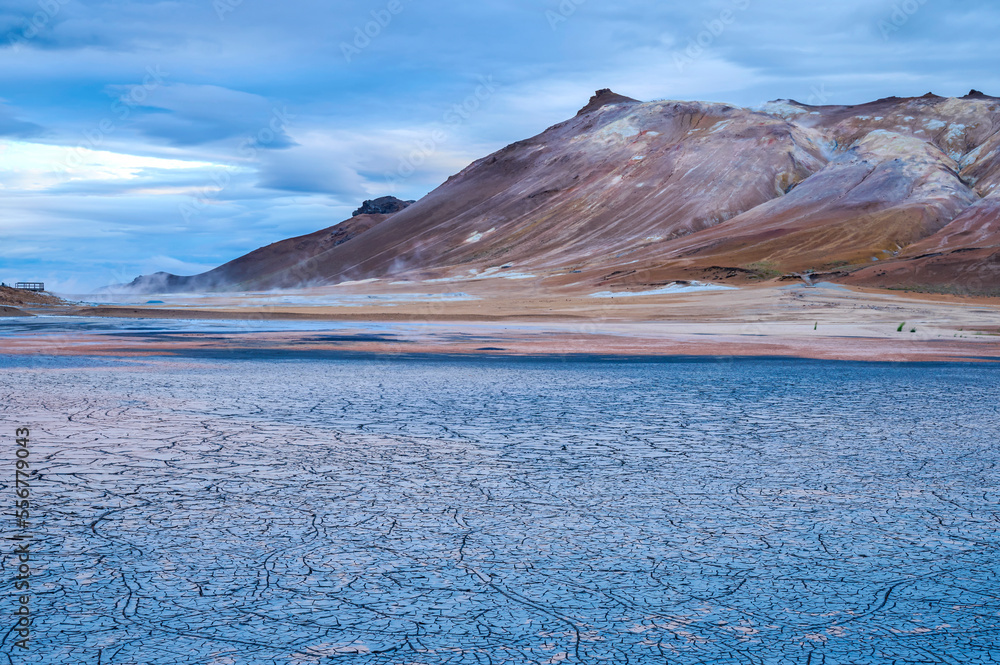 Cracked, dry mud surrounding the mud pots and fumaroles in the Thermal ...