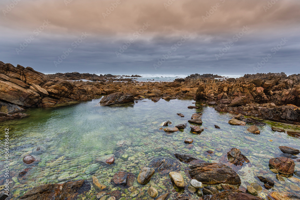 Rocky shore at Cape Agulhas, the Southern Most Point of the Continent ...