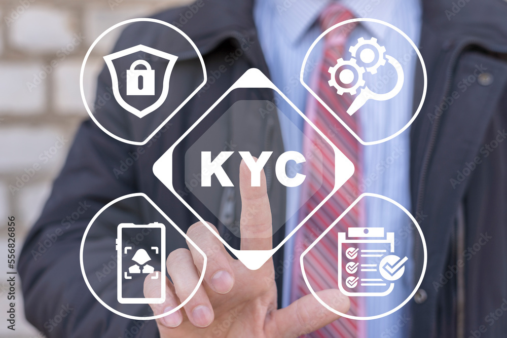 Businessman using virtual touchscreen presses abbreviation: KYC ...
