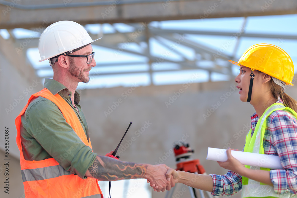 Two Construction Worker show success Using Theodolite Surveying Optical ...