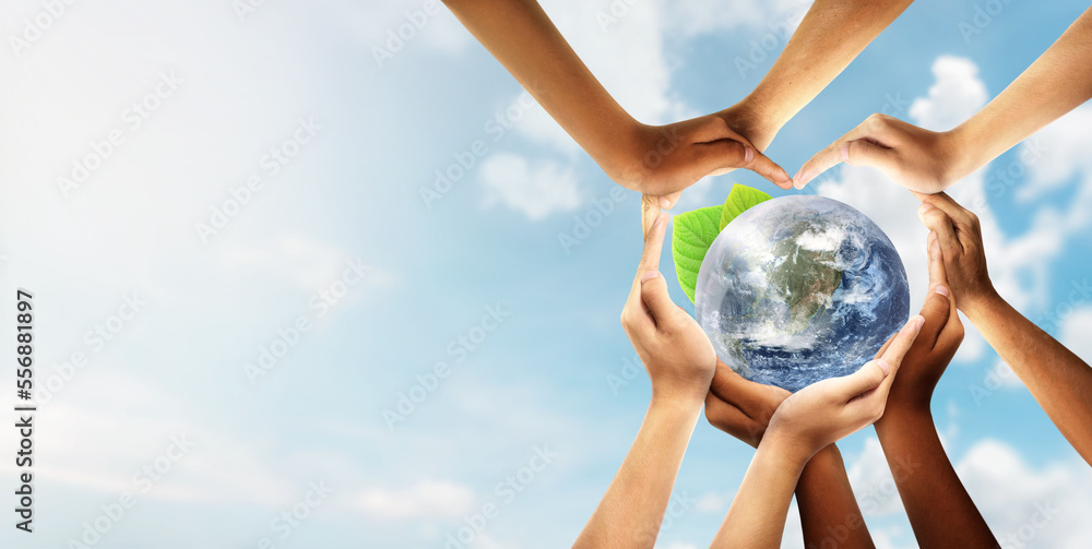 Conceptual symbol of multiracial human hands surrounding the Earth ...