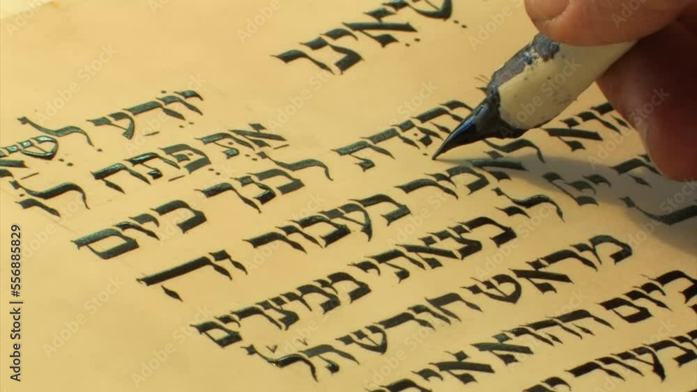 Jewish Sofer writes a Hebrew Passover Haggadah, close view a Jewish ...