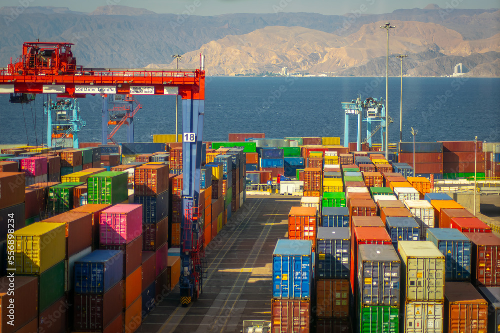 Shipyard full of shipping containers and cranes, trade logistics global ...