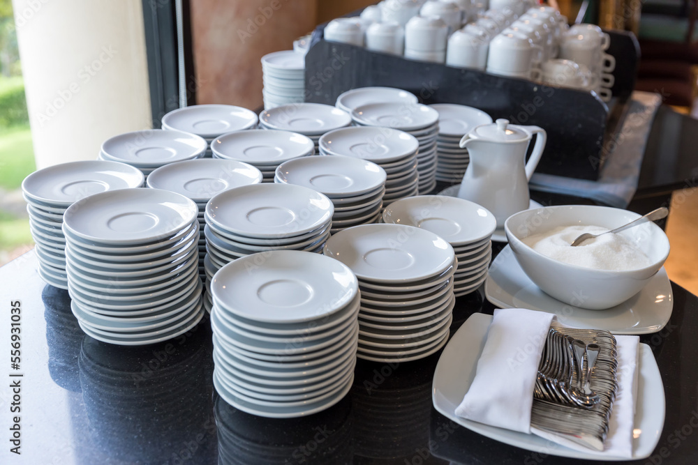 Bar counter with clean dish ready for work. Group of white plates ...