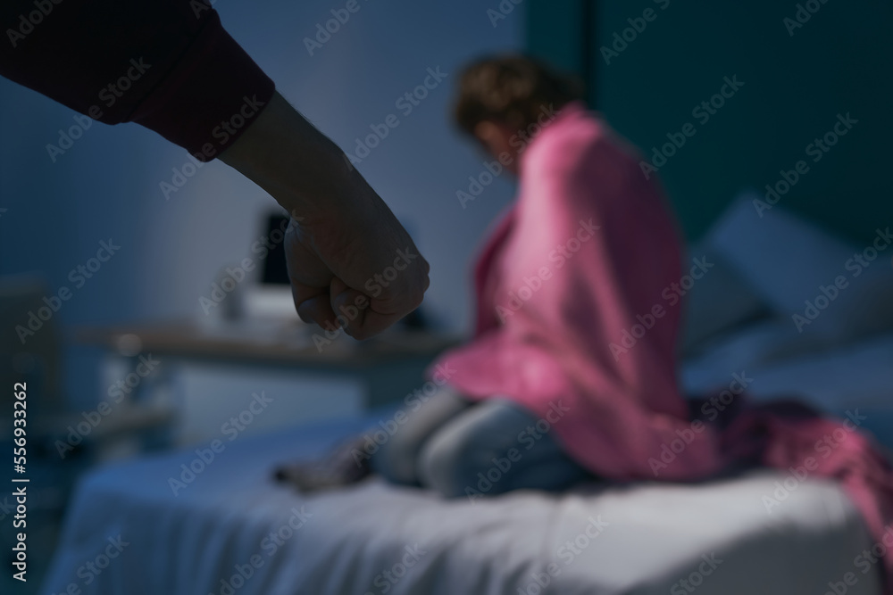 The concept of domestic abuse of a child by father. A man standing with ...