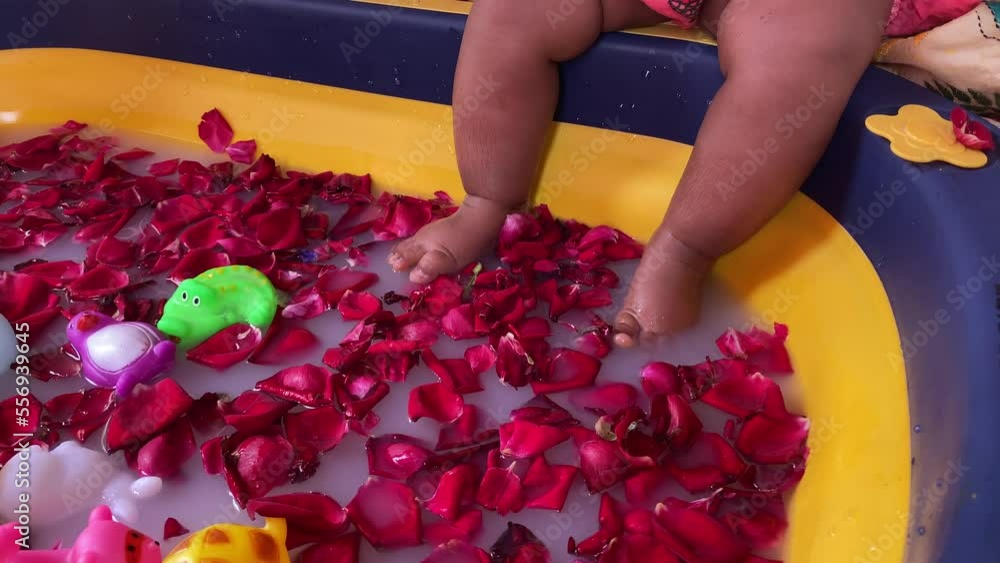 Top shot of baby shower going in the bath tub decorated with rose ...