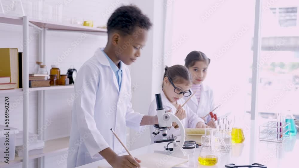 4K, Three school children, studying science, doing chemistry science ...