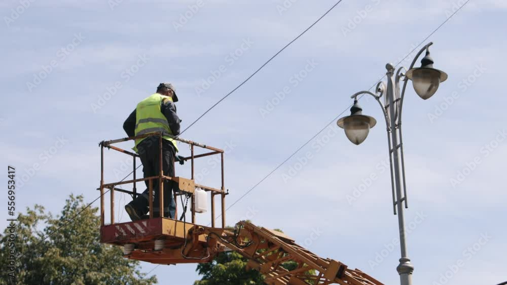 repair street lamp, crane lifted, light bulb. Street light repair work ...