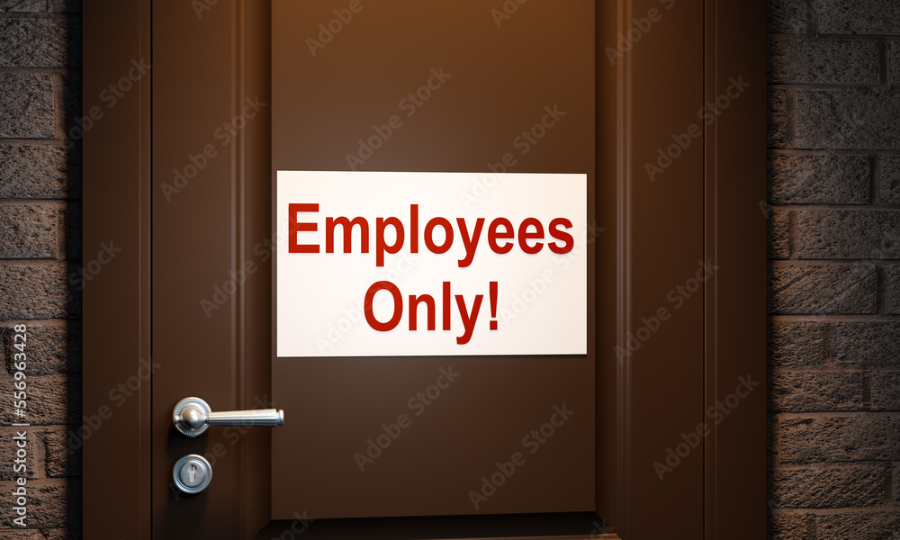 Employees only, door sign. Hallway with brickwall. Door with the board ...