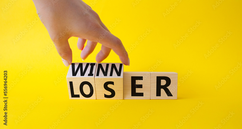 Winner and Loser symbol. Businessman hand turnes wooden cubes and ...