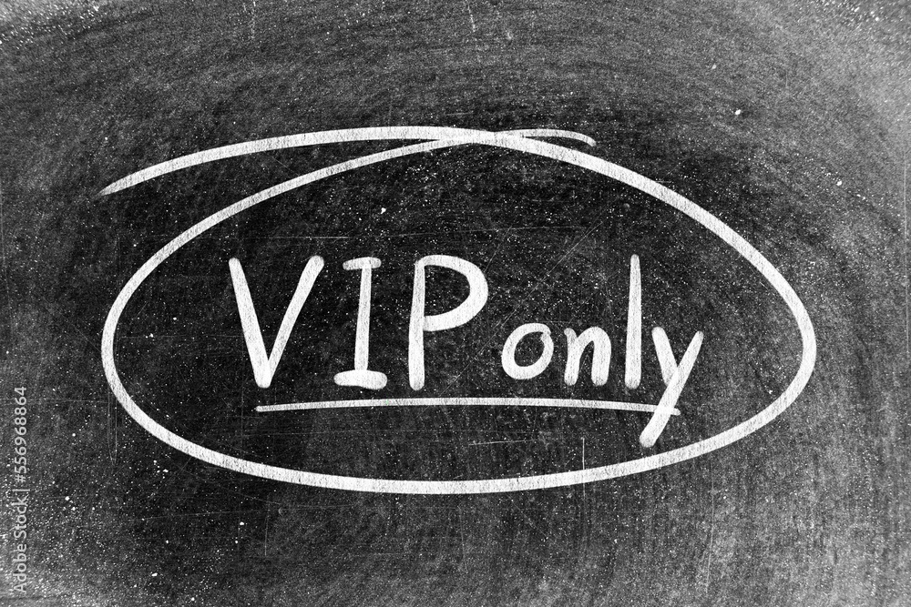 White chalk hand writing in word VIP (abbreviation of very important ...