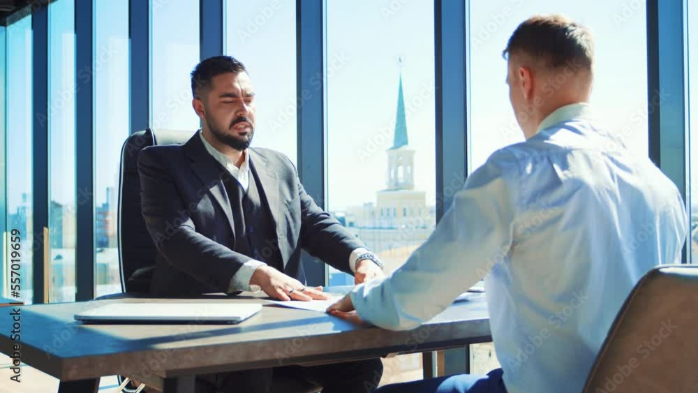 Business people meeting in the office and signing a contract, the man ...