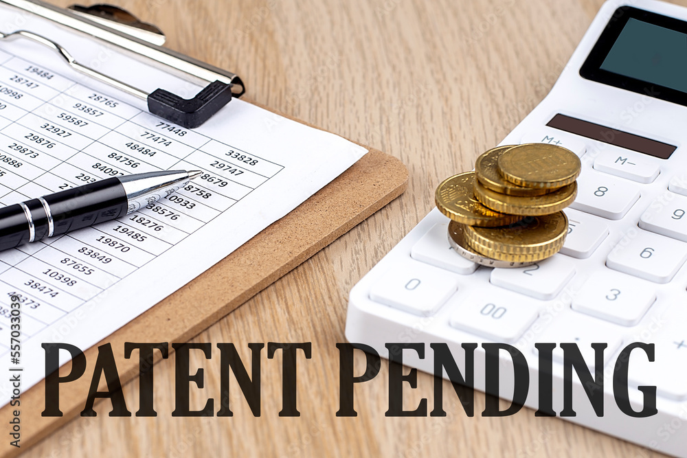 PATENT PENDING text with chart and calculator and coins , business ...