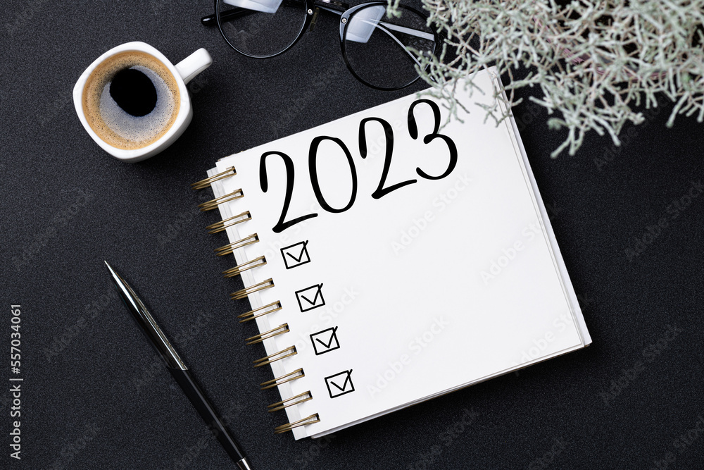 New year resolutions 2023 on desk. 2023 resolutions list with notebook ...
