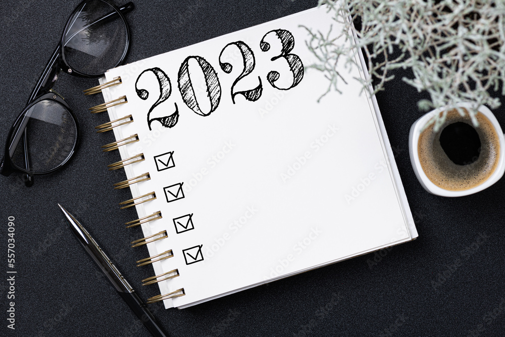 New year resolutions 2023 on desk. 2023 resolutions list with notebook ...