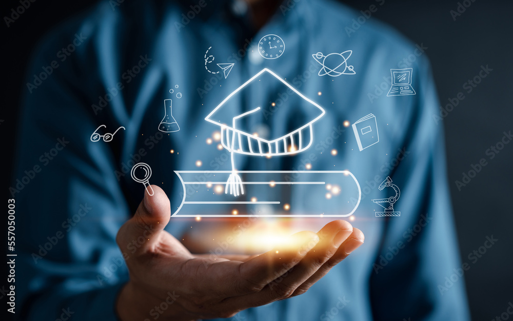 Man hand holding virtual graduation cap and book with learning educate ...