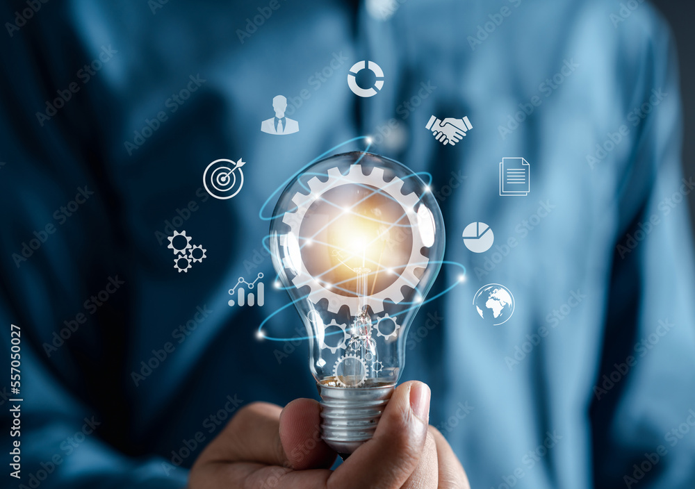 Man hand holding lightbulb with learning educate which for mind ...