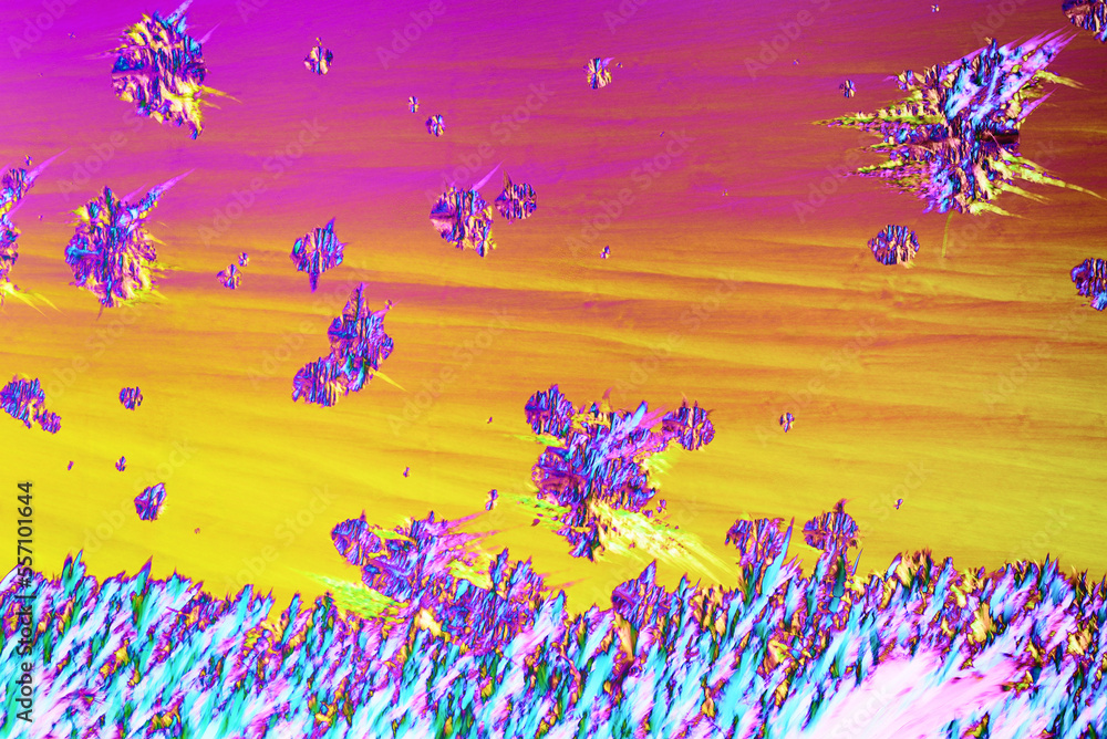 Colorful micro crystals in polarized light. Photo through a microscope ...