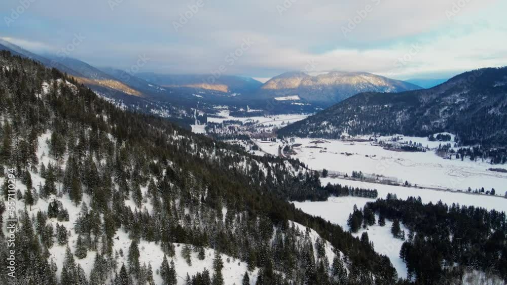 Winter Sunset Magic: Tracking Shot Flying Sideways over Tree-Covered ...