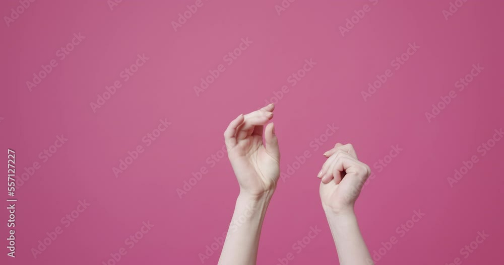 Crop woman snapping fingers in studio. Static shot of unrecognizable ...