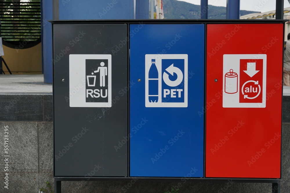 Three waste separation bins in black, blue and red colours for, solid ...