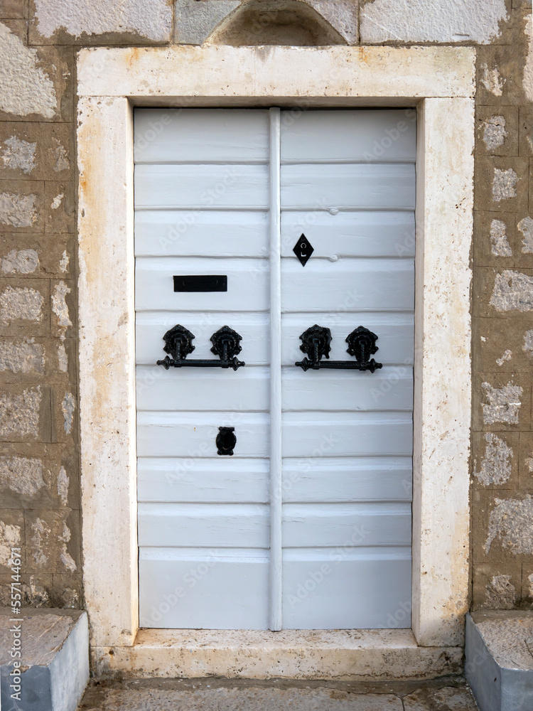 .Old wooden door with massive heavy iron door hadles front view Stock ...