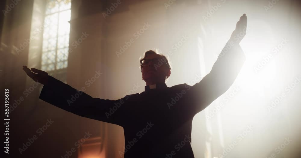 Portrait of Christian Priest Raising Hands In Blessing His Congregation ...
