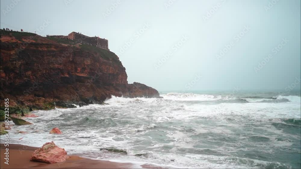 Huge waves at Nazare in Portugal where surfers are being towed in to ...