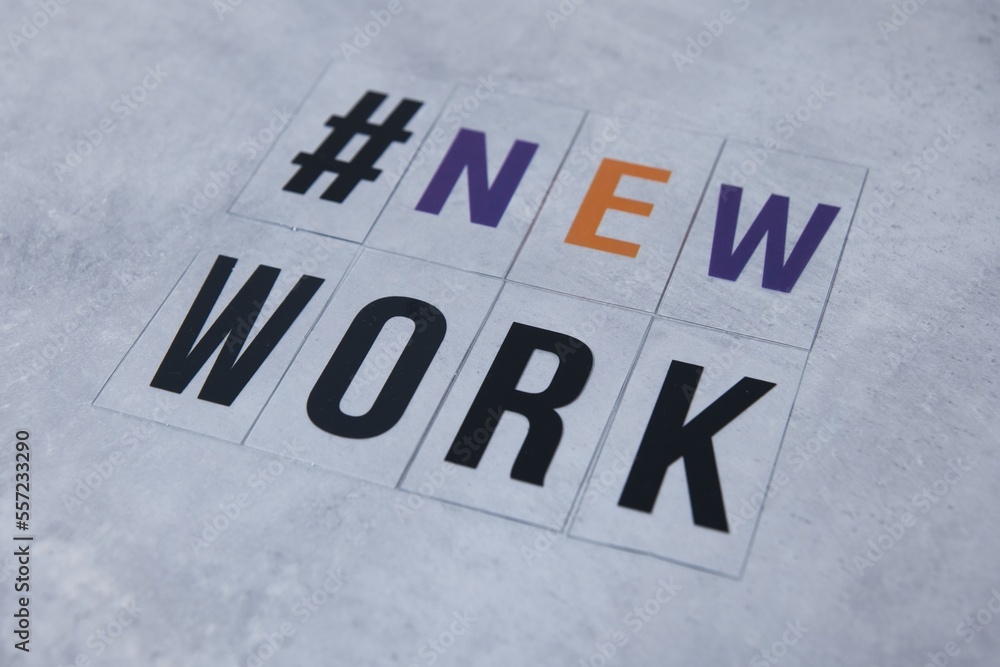 Letters on concrete background saying "#newwork". New work concepts ...