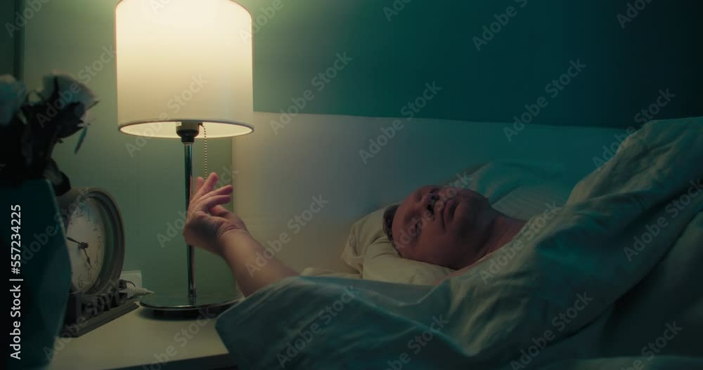 Man falling into bed and going to sleep at night, switch off night ...