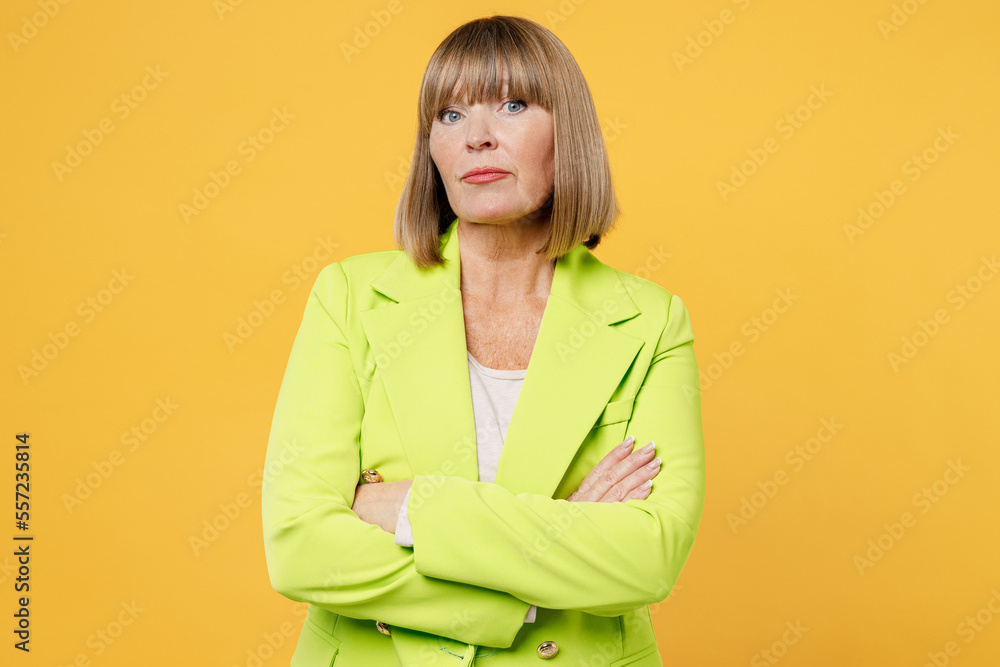 Elderly indignant sad mad woman 50s years old wearing green jacket ...