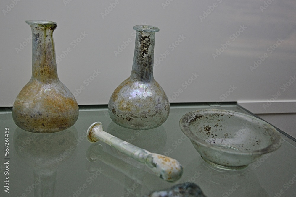 Ancient mortar, pestle, laboratory flasks and other pharmaceutical or ...