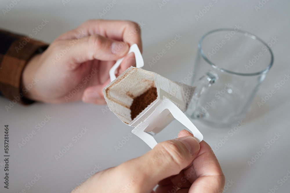 brewing process,a bag filled with boiling water for drip coffee in a ...