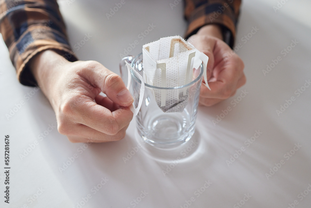 brewing process,a bag filled with boiling water for drip coffee in a ...