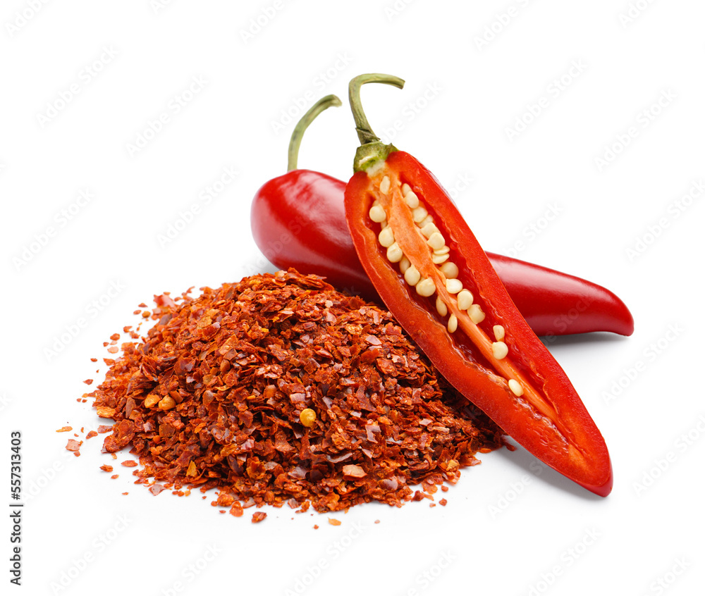 Heap of chipotle chili flakes and fresh jalapeno peppers isolated on ...