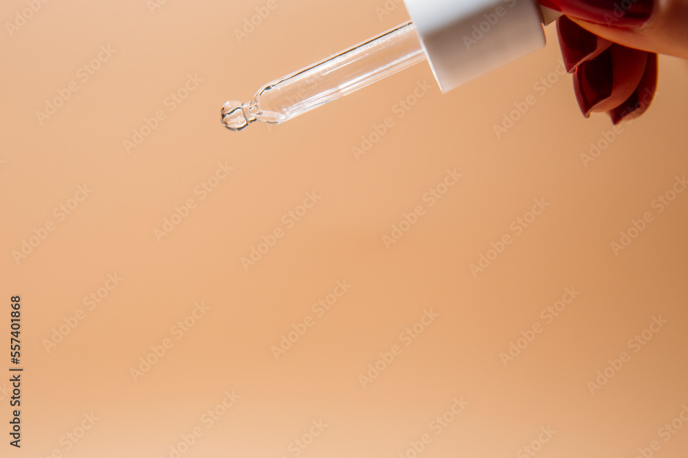 Woman hand holding pipette with collagen moisturizing hyaluron serum ...