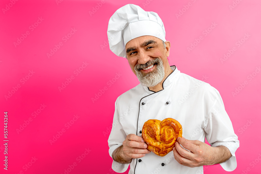 Baker man in love on valentine's day wearing chef's outfit. Chef-cooker ...
